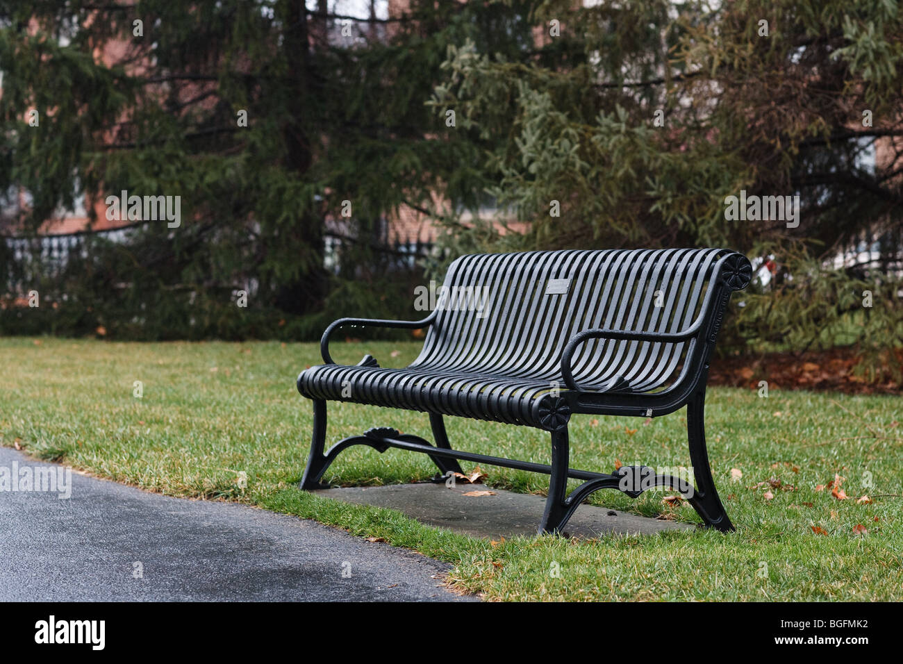 An empty bench in a park Stock Photo - Alamy