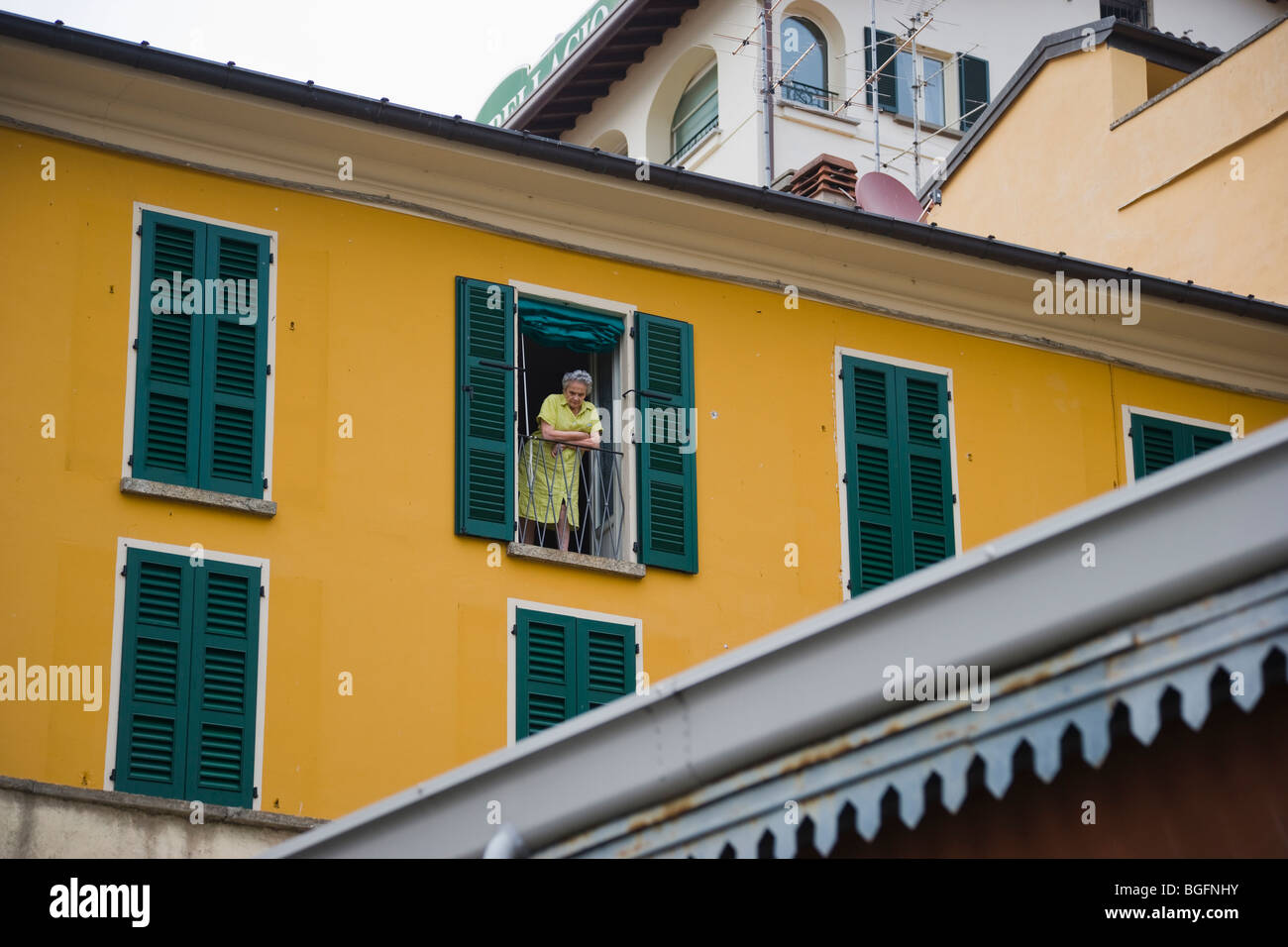 Woman standing in a balcony, Bellagio, Italy Stock Photo - Alamy