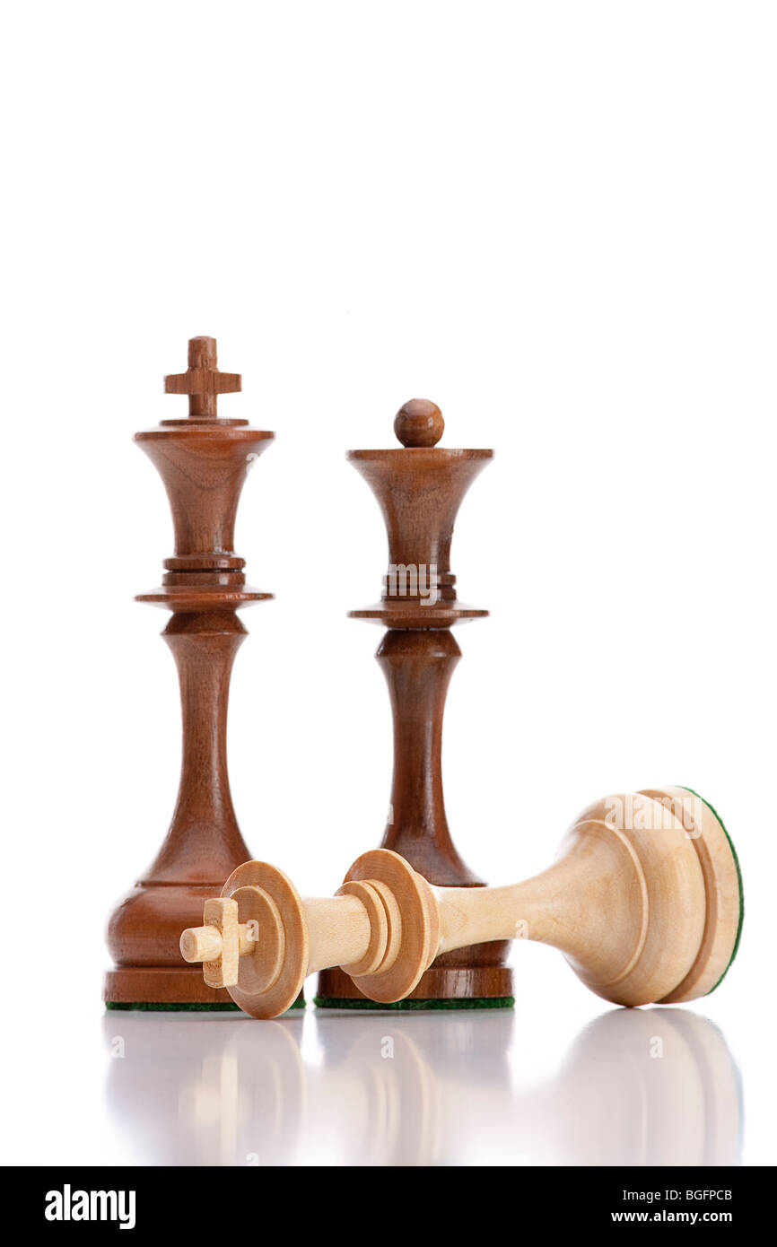 chess - black king and queen standing over defeated white king Stock ...