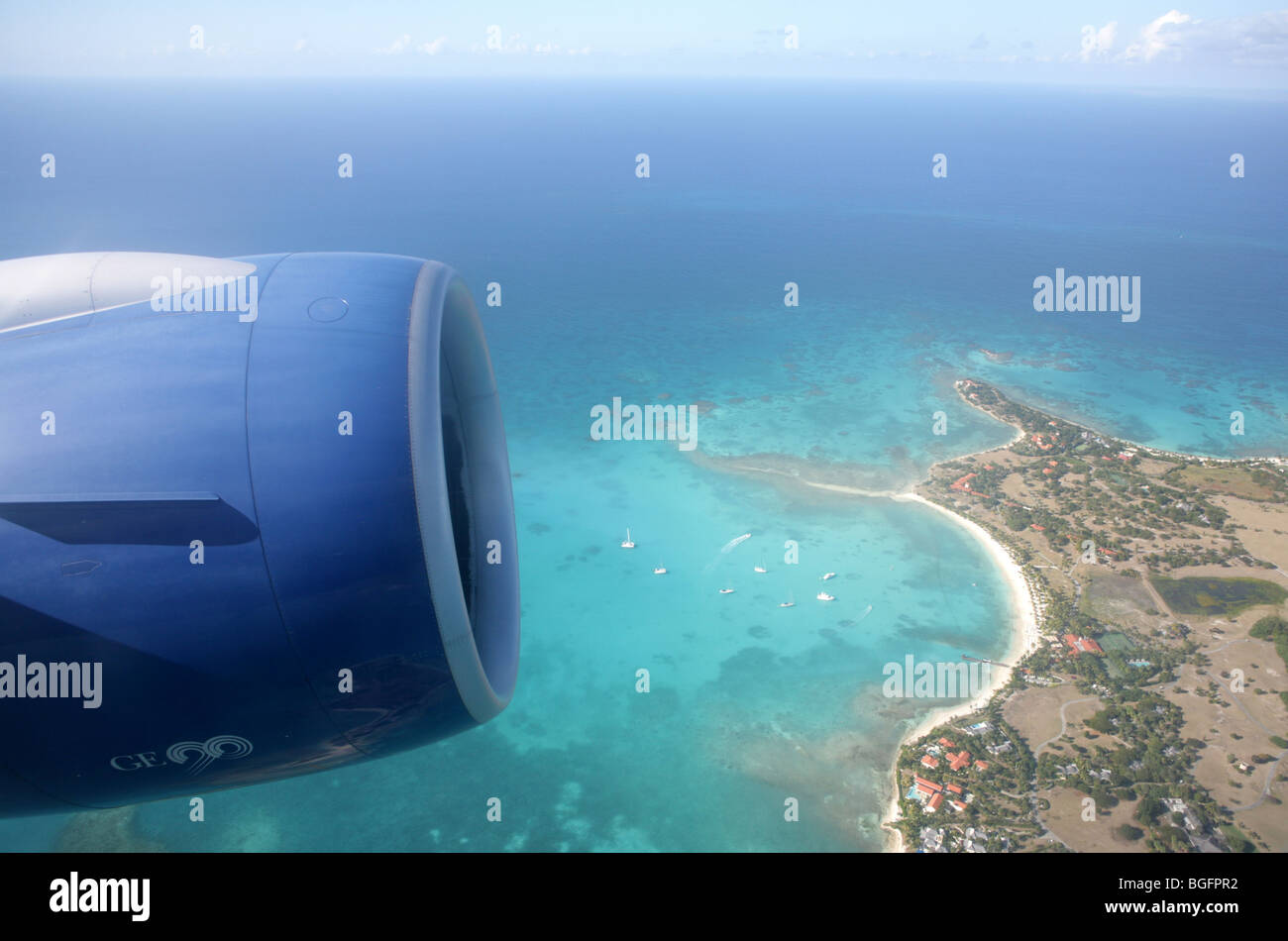 Plane flying over Caribbean islands Stock Photo - Alamy