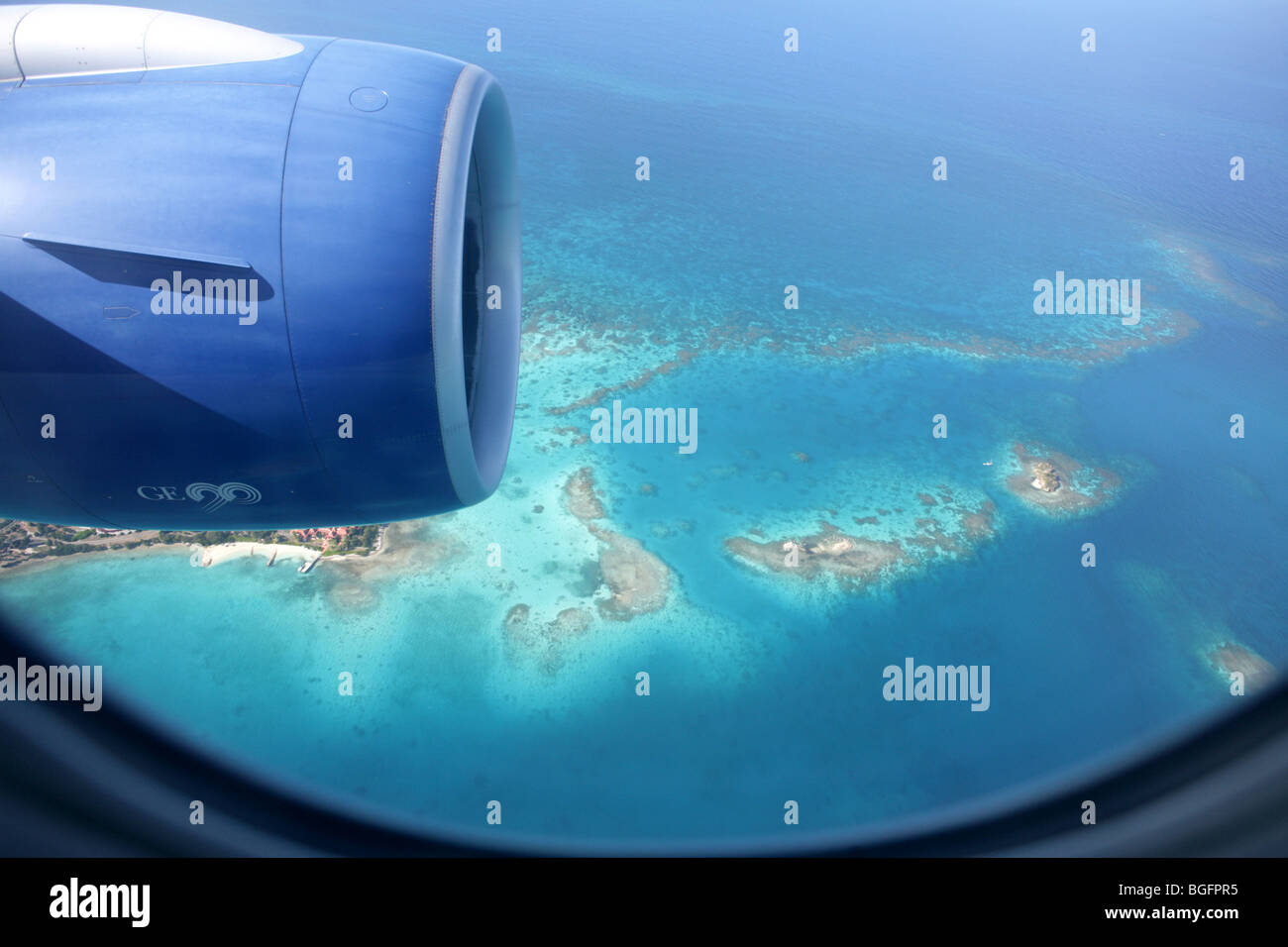 Plane flying over Caribbean islands Stock Photo - Alamy
