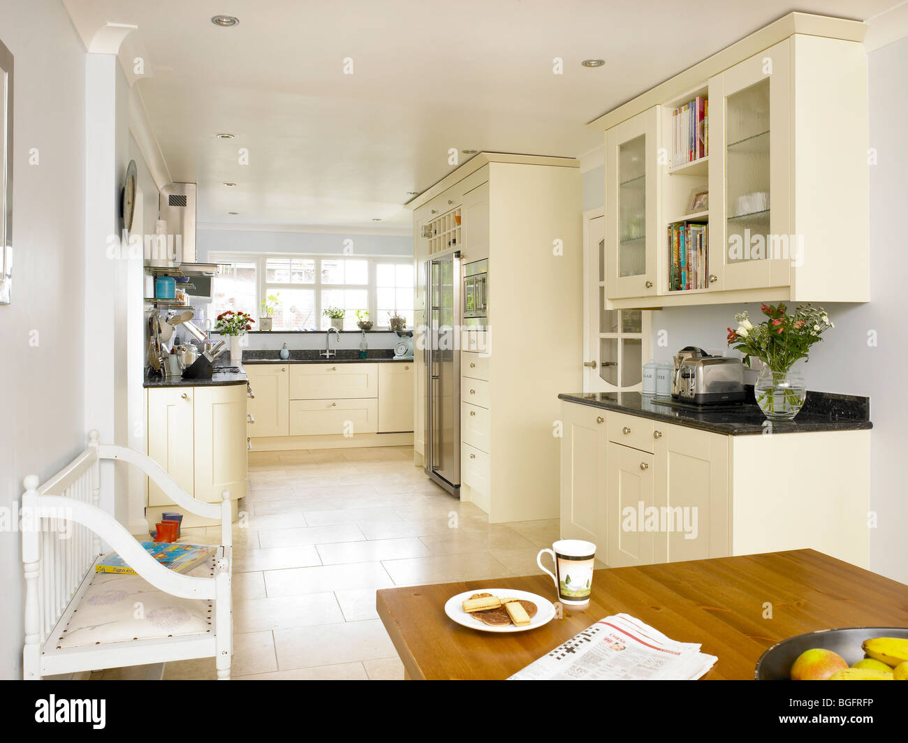 A view of the interior of a cream fitted kitchen Stock Photo - Alamy
