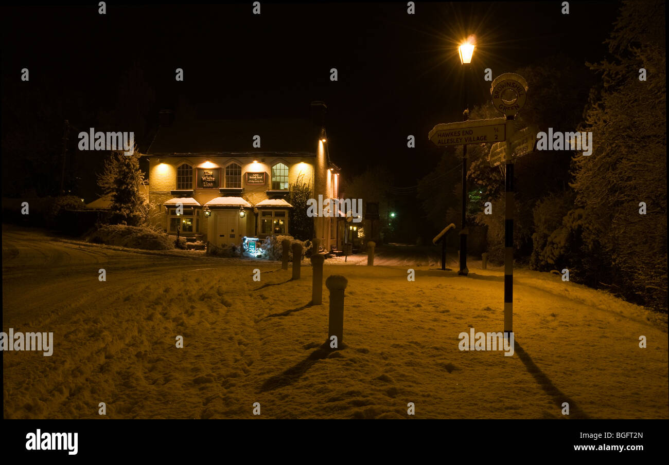 Snow bound traditional English pub at night Stock Photo - Alamy