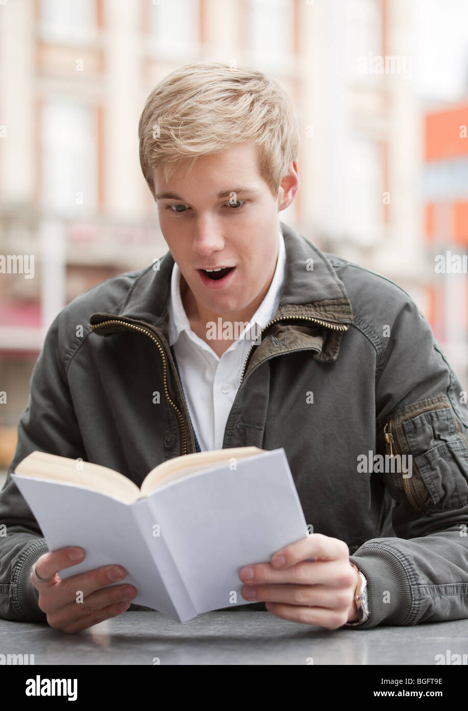 Man reading book shocked expression hi-res stock photography and images ...