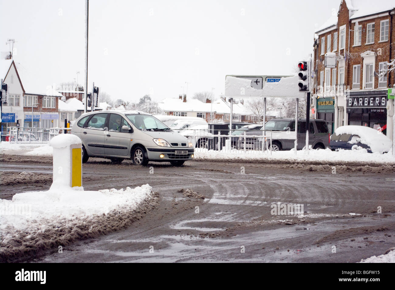 Car Driving Through The Slush And Snow Stock Photo - Alamy