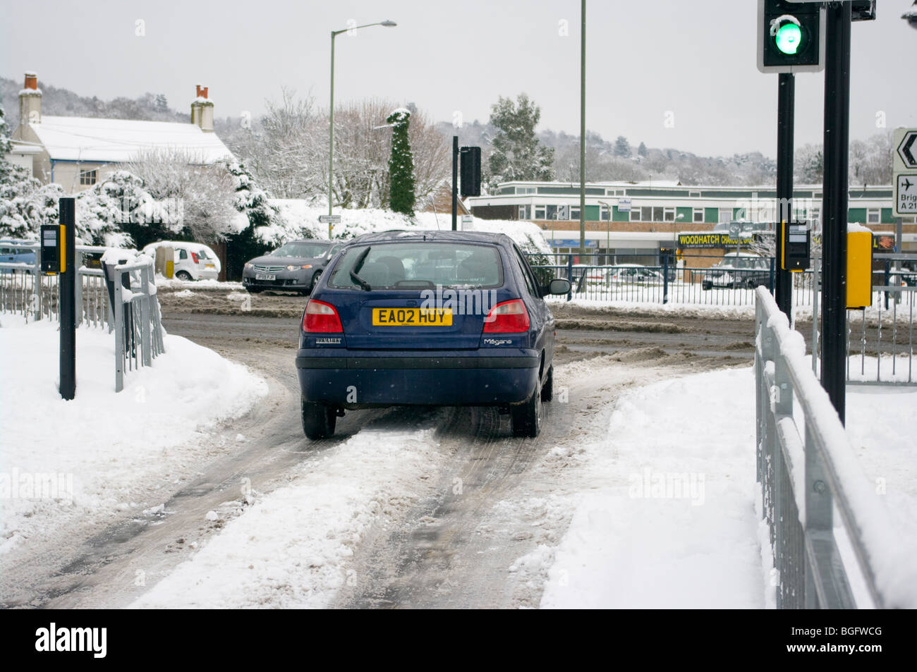 Car Driving Through The Slush And Snow Stock Photo - Alamy