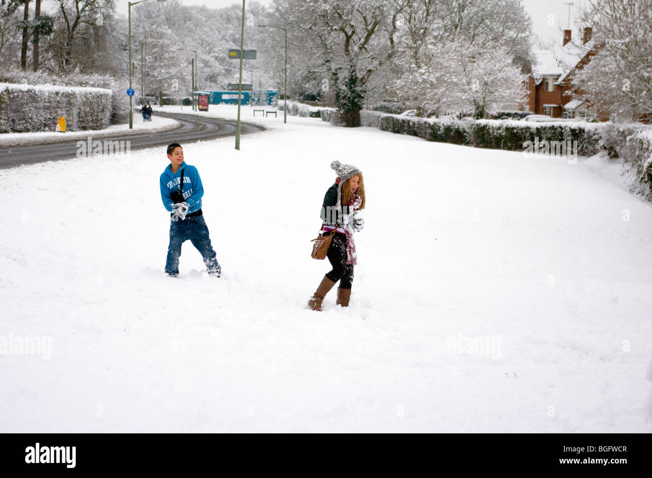 Children throwing snowballs hi-res stock photography and images - Alamy