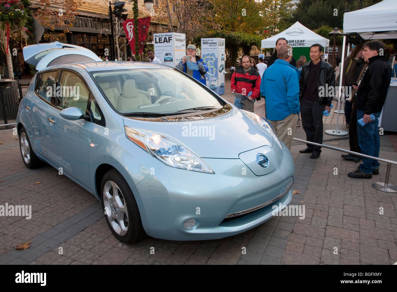 Crowd looking at new Nissan Leaf zero emission electric car. Nissan ...