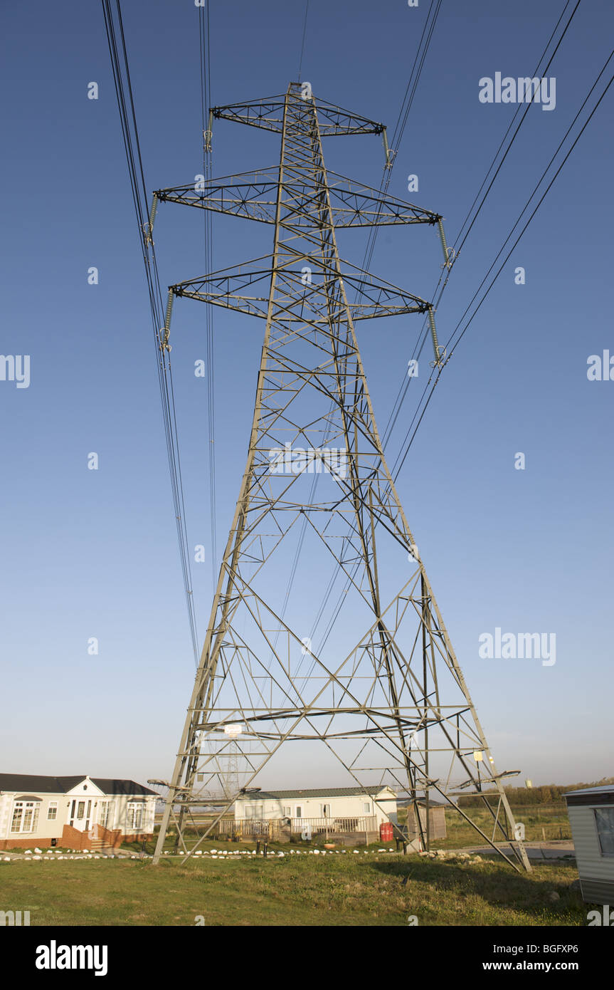Power line pylon going above a residential housing Stock Photo - Alamy