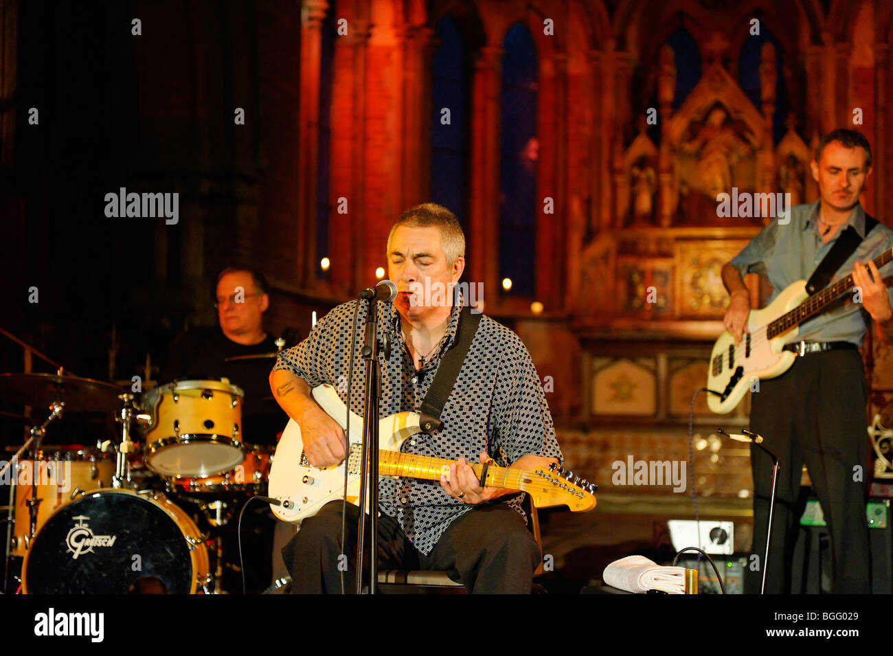 Man playing guitar in church hi-res stock photography and images - Alamy