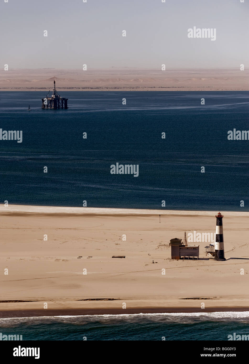Pelican Point lighthouse Walvis Bay Namibia with oil rig in background ...