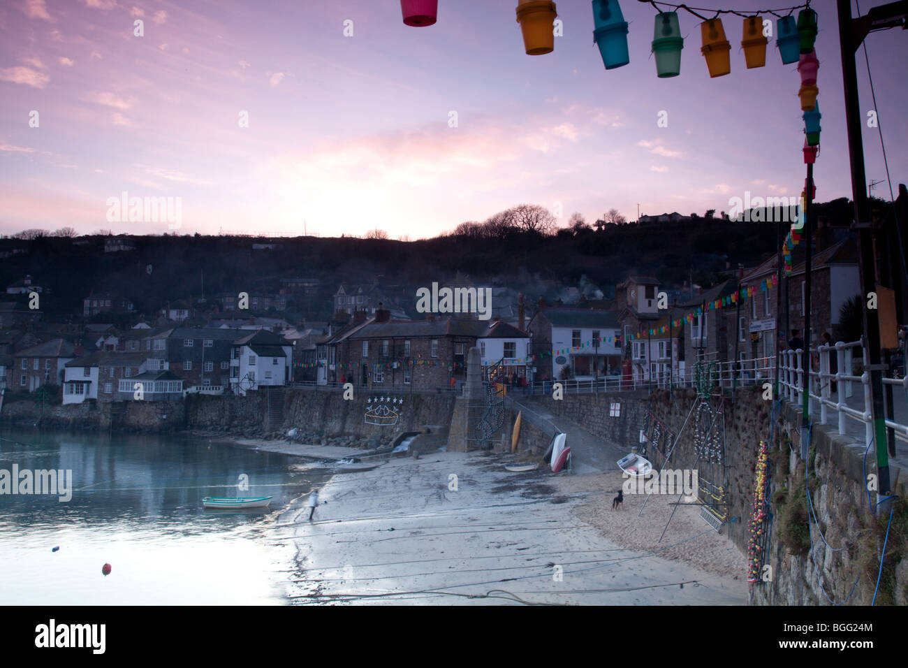 Mousehole harbour sunset at Christmas, Cornwall, UK Stock Photo - Alamy