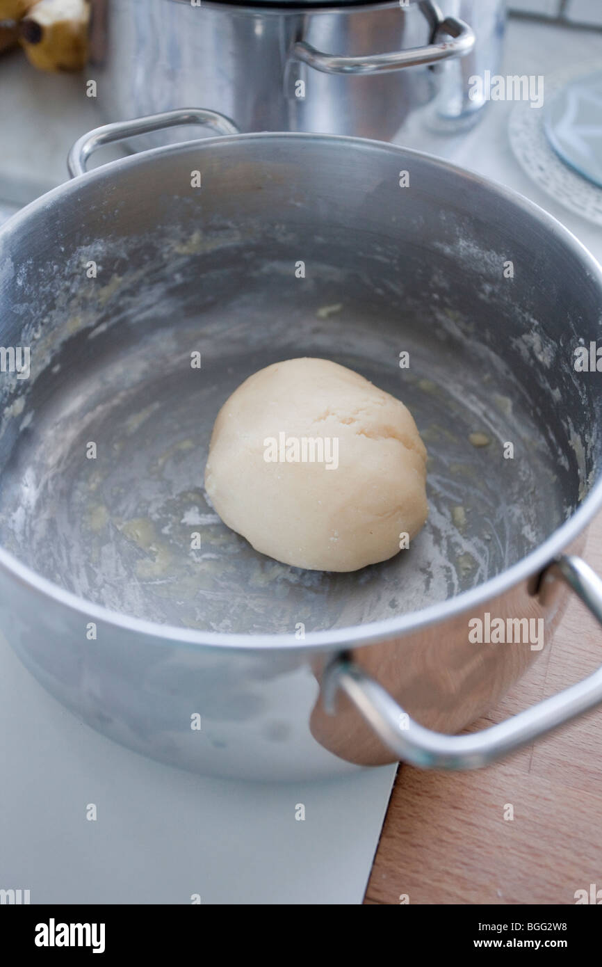 Fresh dough resting in a stainless steel mixing bowl, ready for baking ...