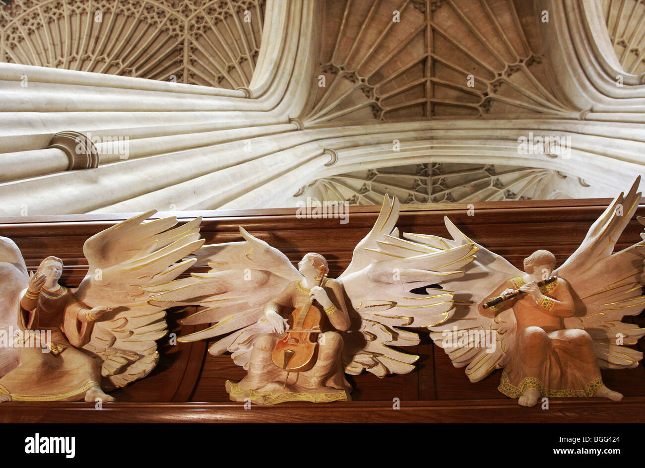 Carved wooden angels play musical instruments beneath the soaring Gothic ceiling of Bath Abbey ...