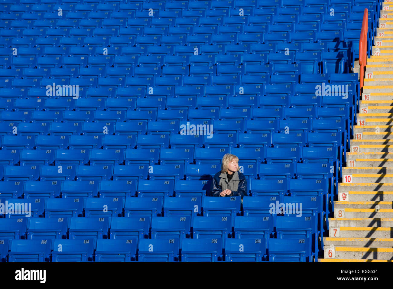 Sitting in the bleachers Stock Photo - Alamy