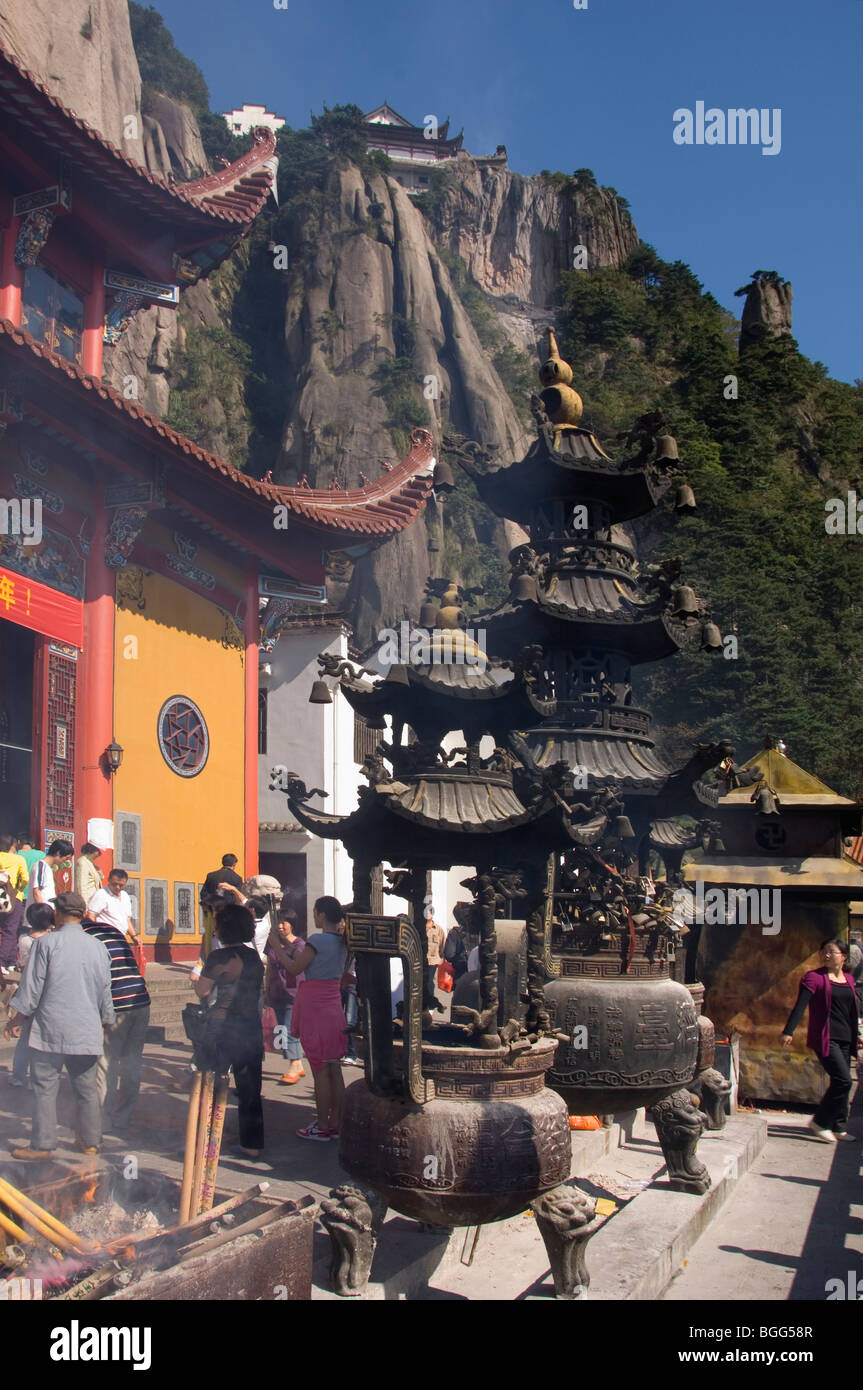 Worshipers burning incense sticks at one of the temples close to the ...