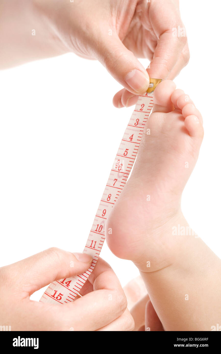 Measuring of infant's feet Stock Photo - Alamy