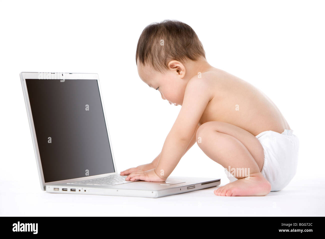 Infant with laptop Stock Photo - Alamy