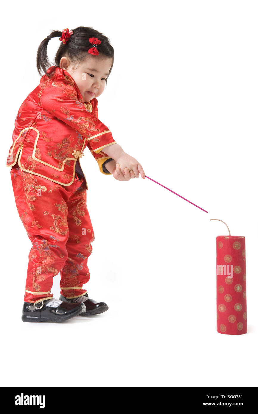 Young girl playing firecrackers Stock Photo - Alamy