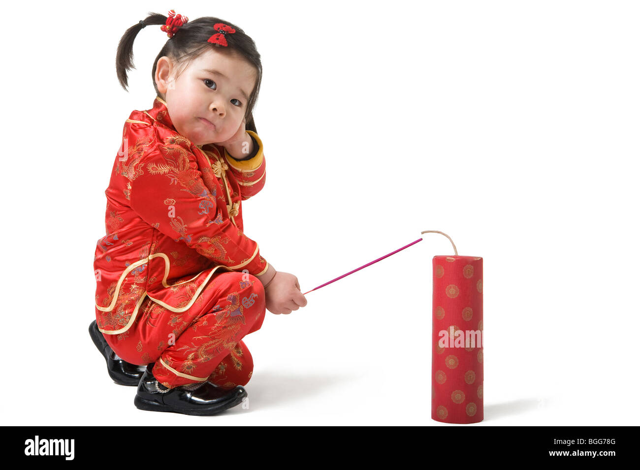 Young girl playing firecrackers Stock Photo - Alamy