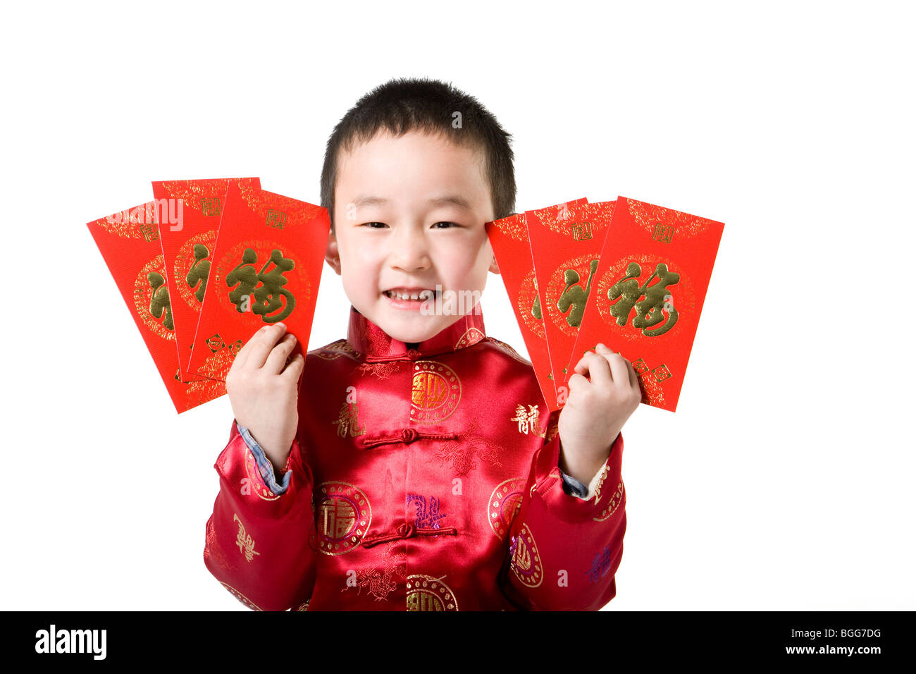Boy in Chinese traditional clothes holding red envelop Stock Photo - Alamy