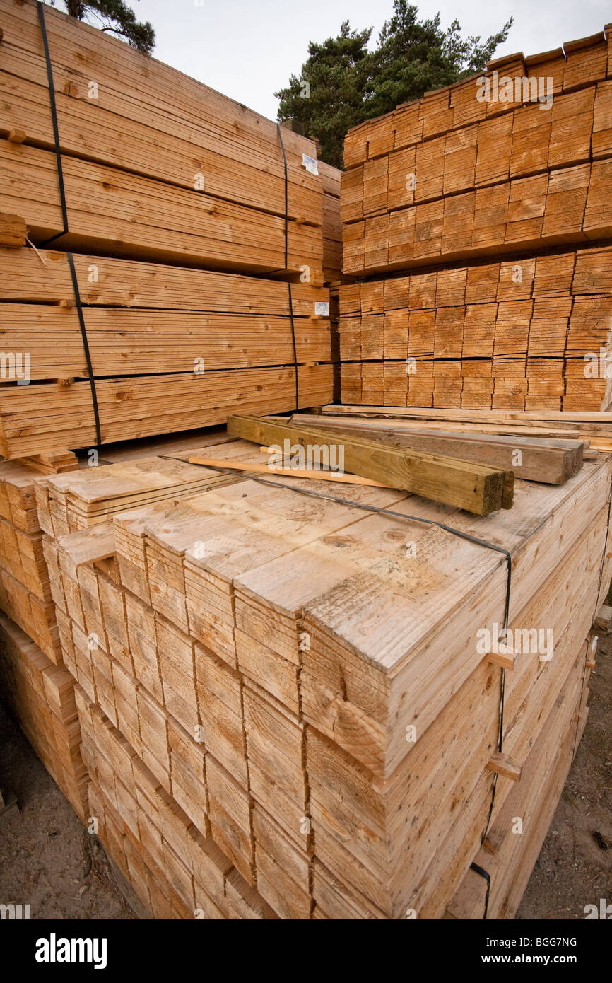 Modern treated wooden fencing in stacks at timber Merchants, England ...