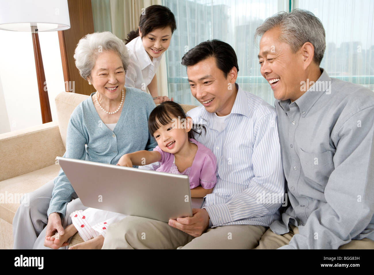Parents look at laptop screen hi-res stock photography and images - Alamy