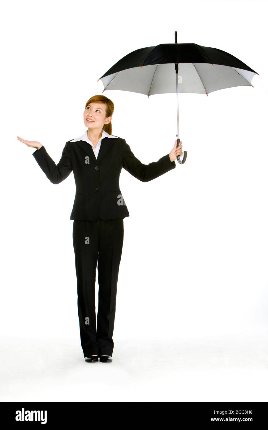 Woman Looking Out From Under Umbrella Stock Photo - Alamy