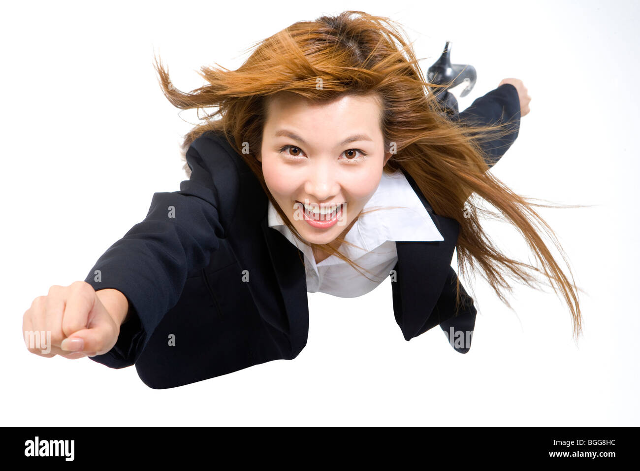 Young Businesswoman Flying Through The Air Stock Photo - Alamy