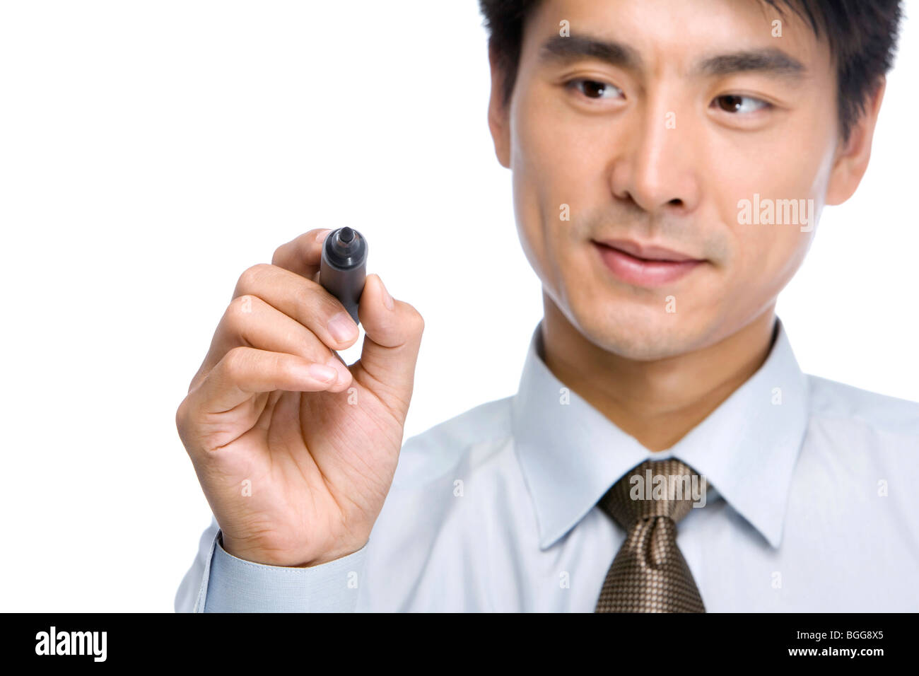 Young businessman writing on transparent board Stock Photo - Alamy