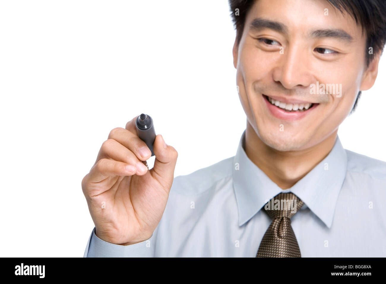 Young businessman writing on transparent board Stock Photo - Alamy