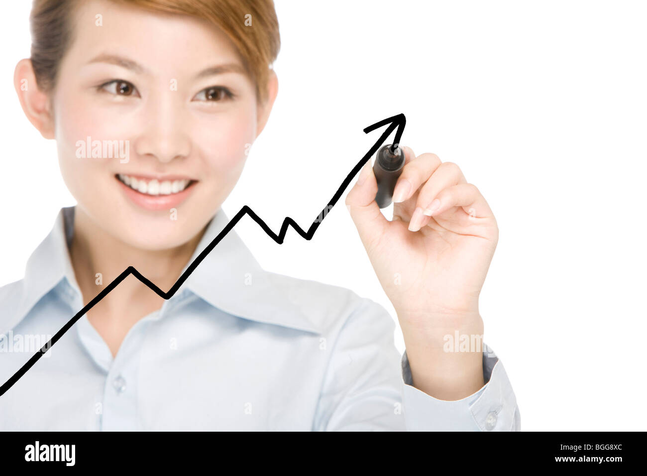 Young businesswoman writing on transparent board Stock Photo - Alamy