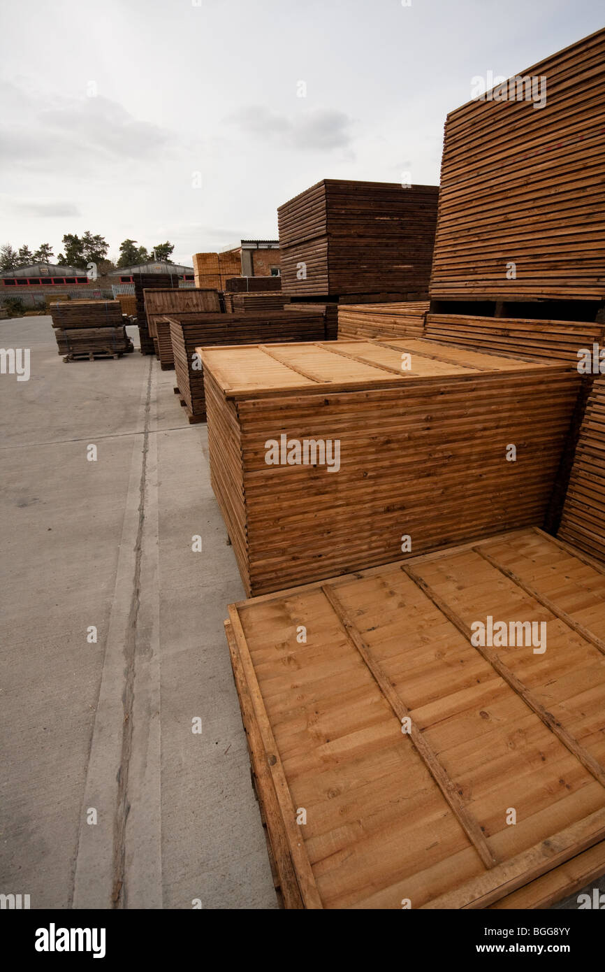 Modern treated wooden fencing in stacks at timber Merchants, England ...
