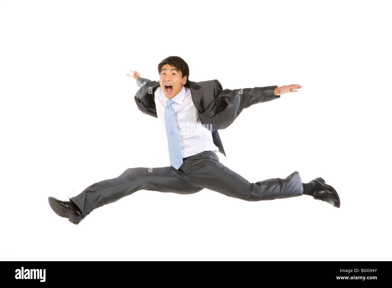 Young businessman jumping in mid-air Stock Photo - Alamy Young businessman jumping in mid-air Stock Photo - Alamy