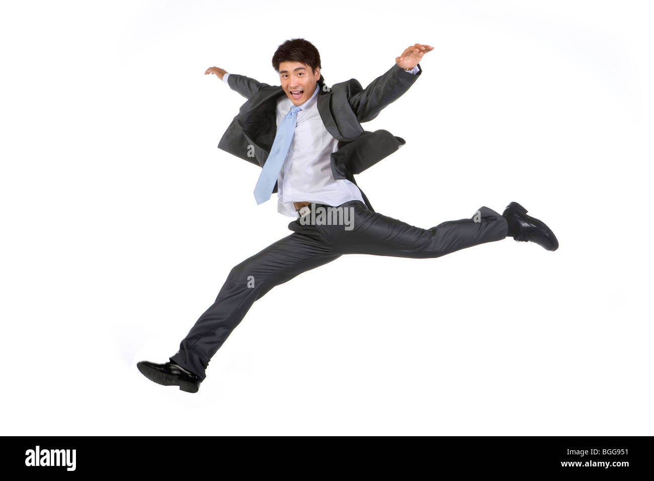 Young businessman jumping in mid-air Stock Photo - Alamy Young businessman jumping in mid-air Stock Photo - Alamy
