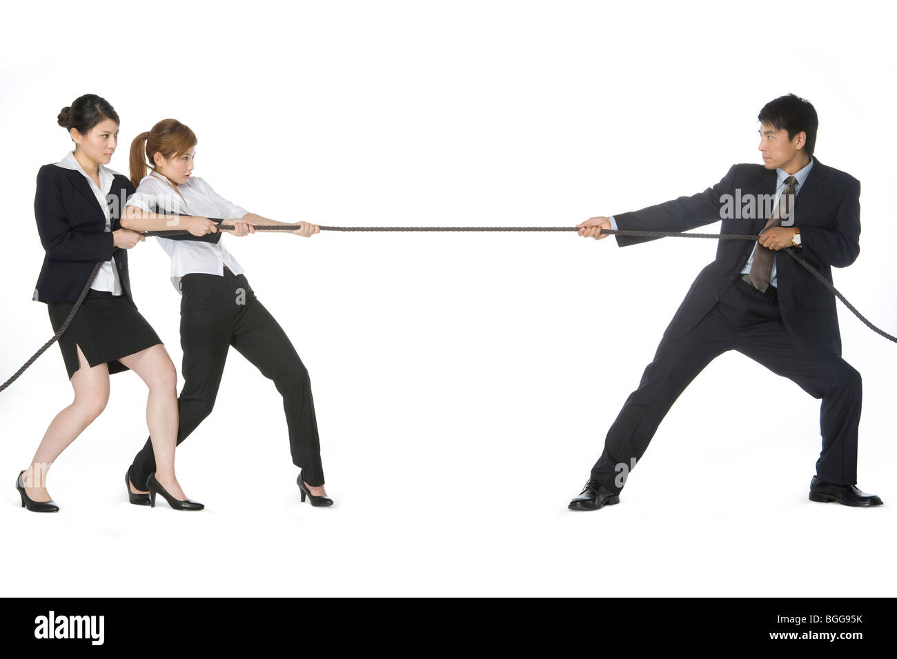 Businessmen pulling rope Stock Photo - Alamy