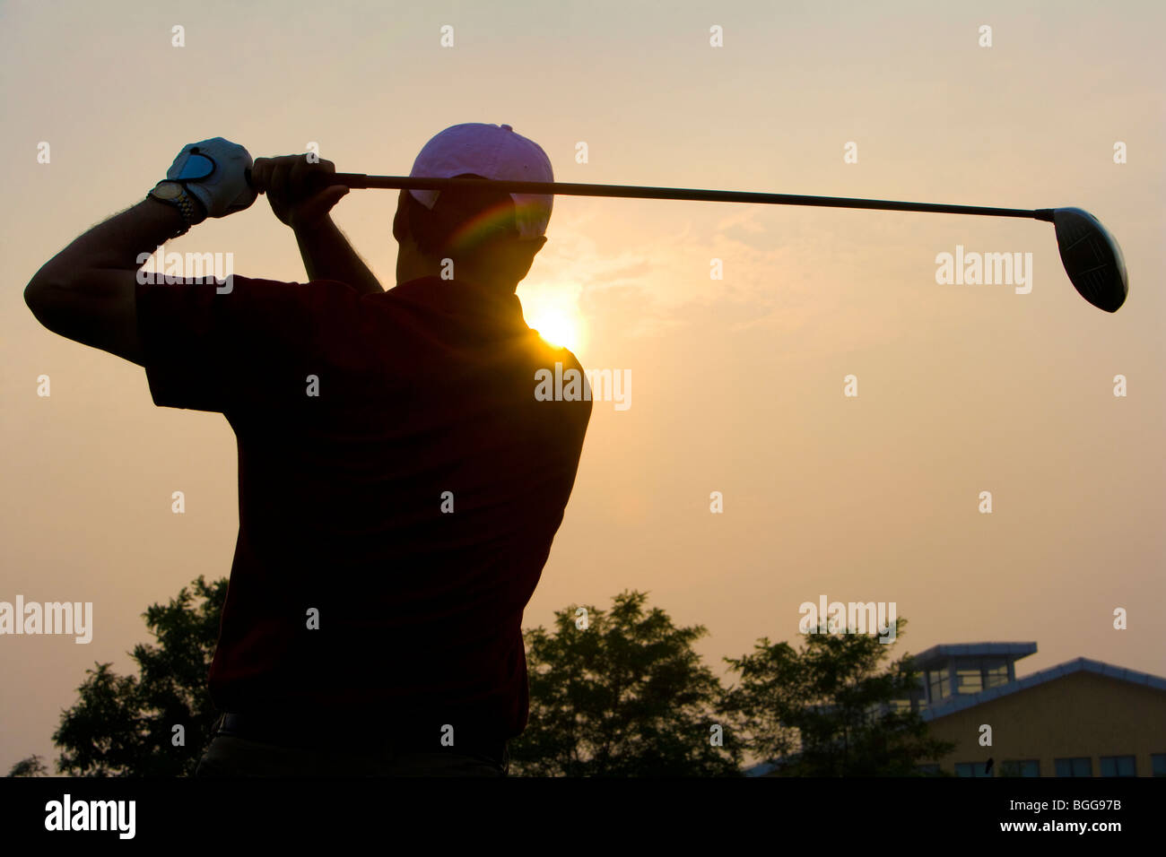 Silhouette of Golfer at Sunset Stock Photo - Alamy