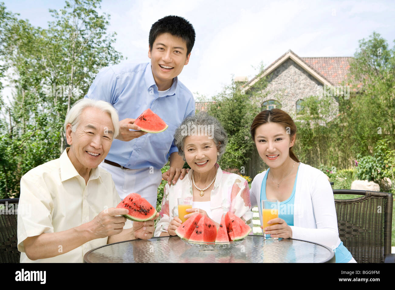 Family eating watermelon Stock Photo - Alamy