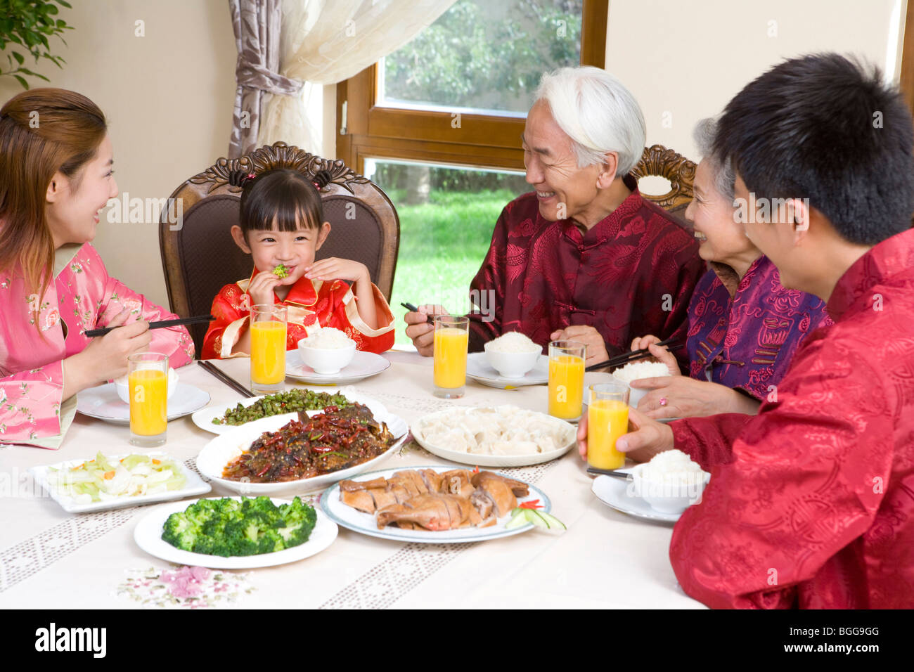 Family having Chinese New Year dinner Stock Photo - Alamy