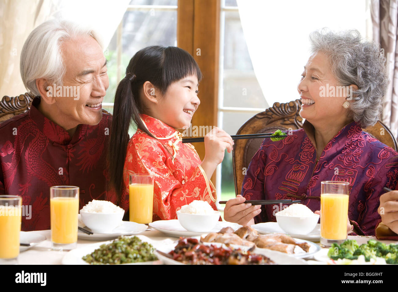 Family having Chinese New Year dinner Stock Photo - Alamy