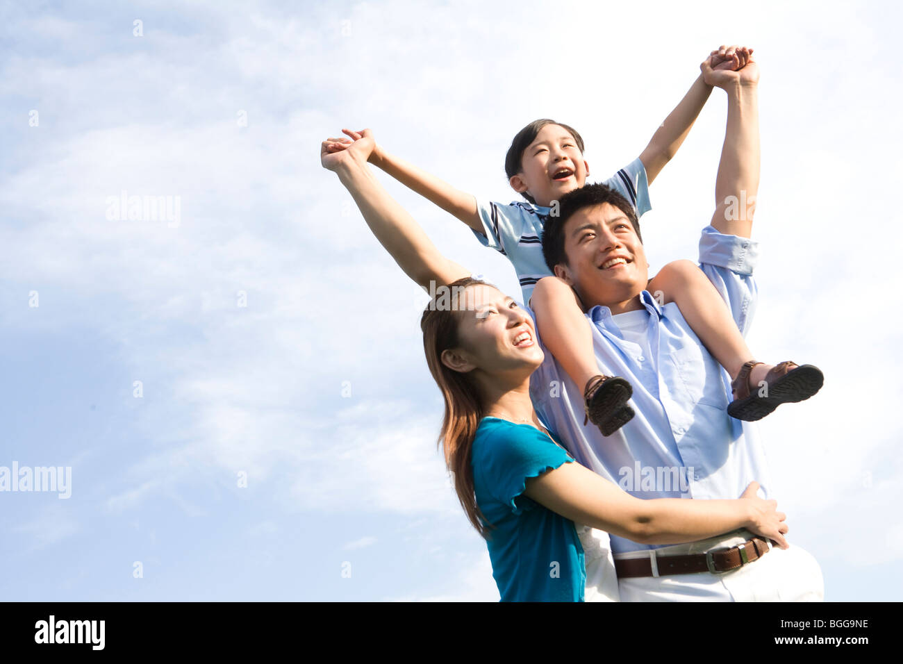 Portrait of a family of three Stock Photo - Alamy