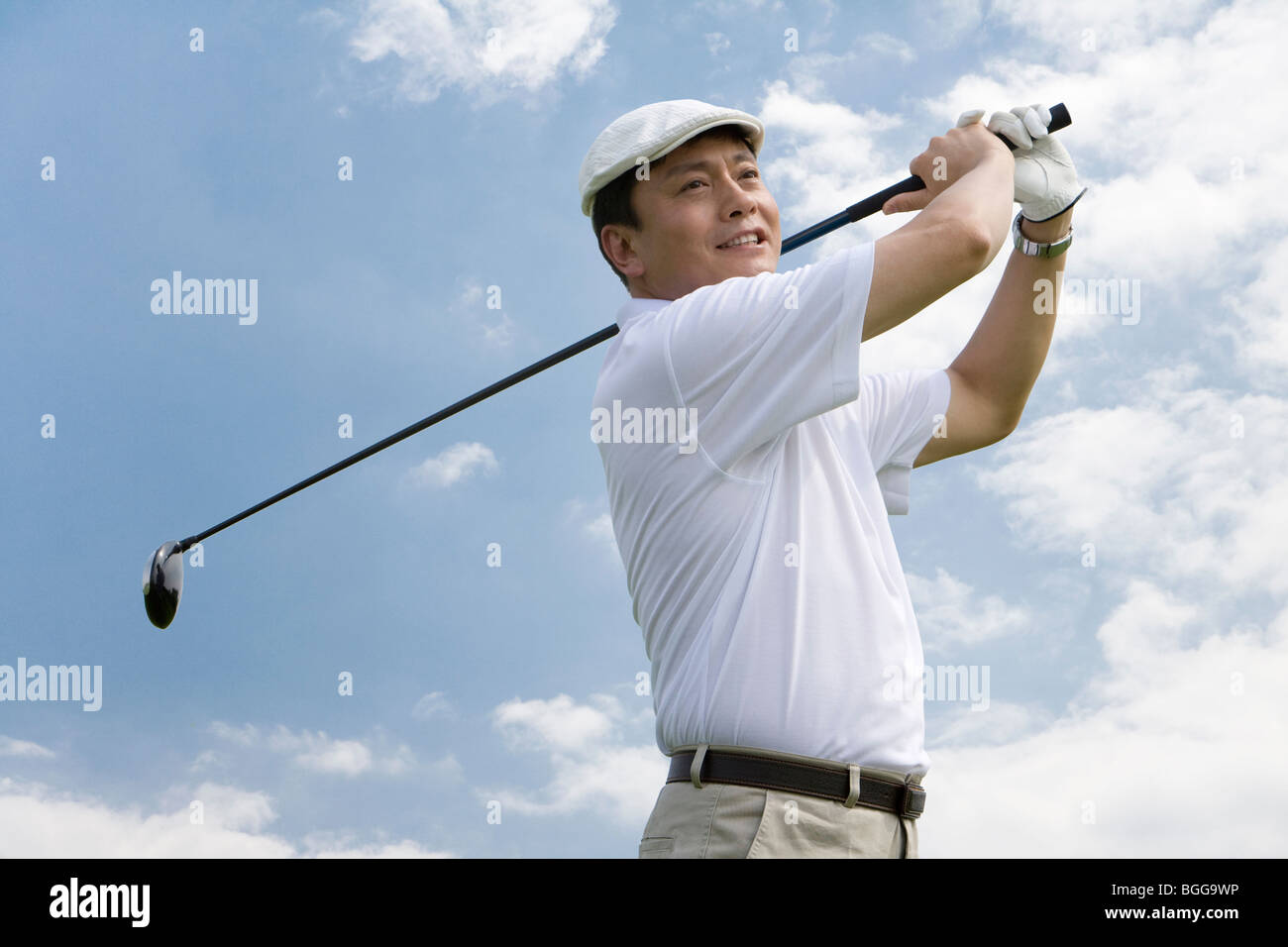Mature male golfer hitting hi-res stock photography and images - Alamy