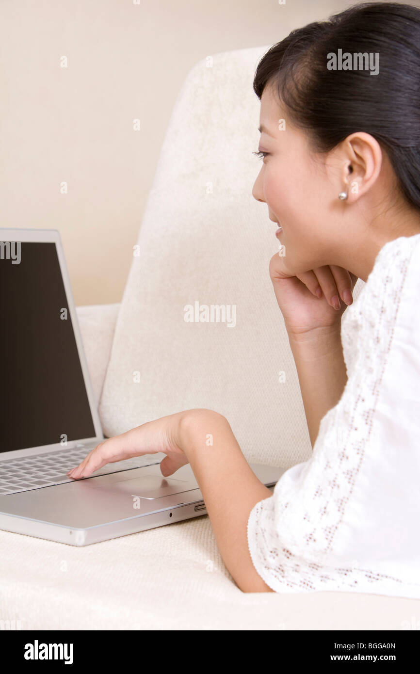 Asian woman with laptop Stock Photo - Alamy