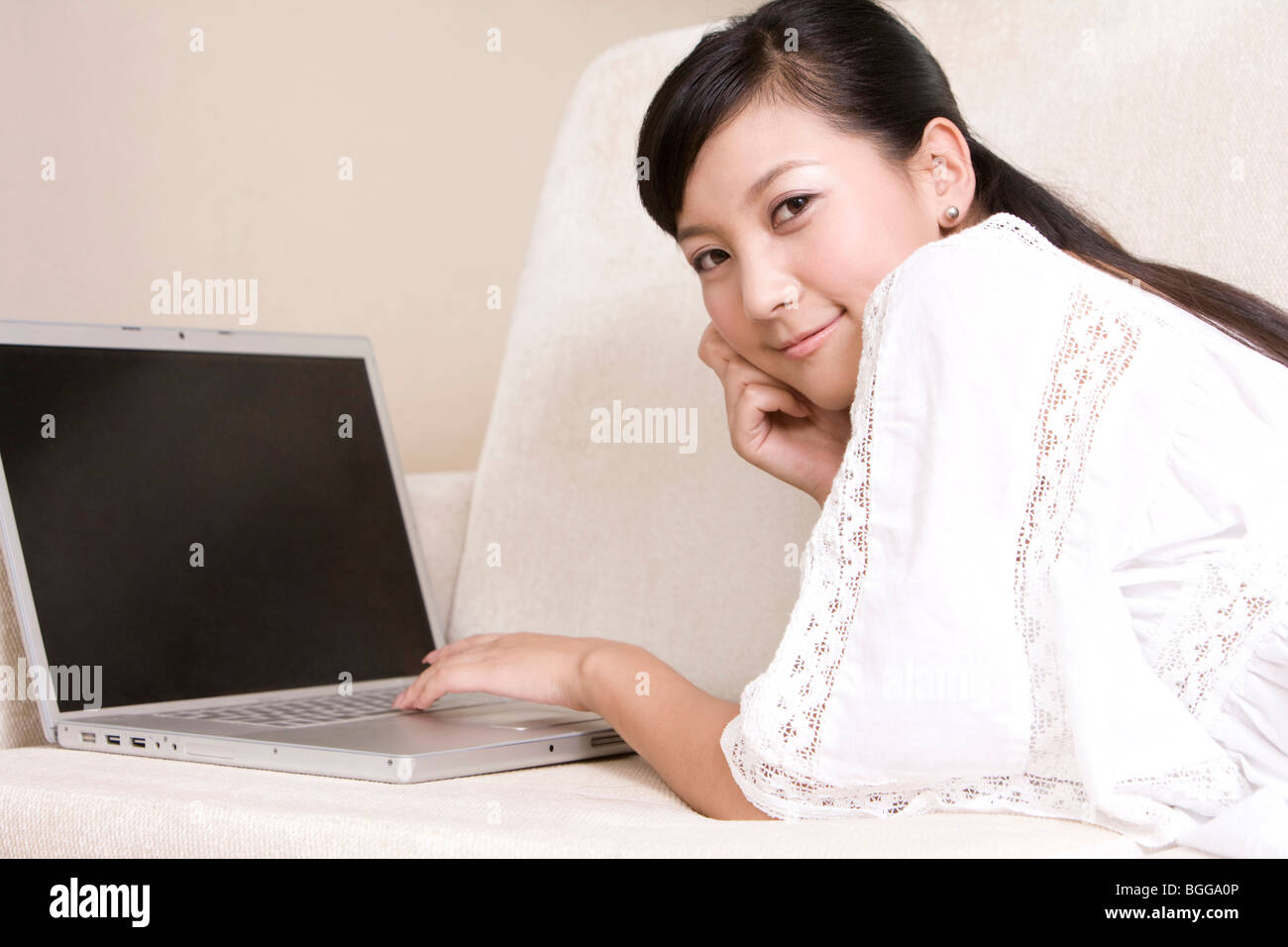 Asian woman with laptop Stock Photo - Alamy