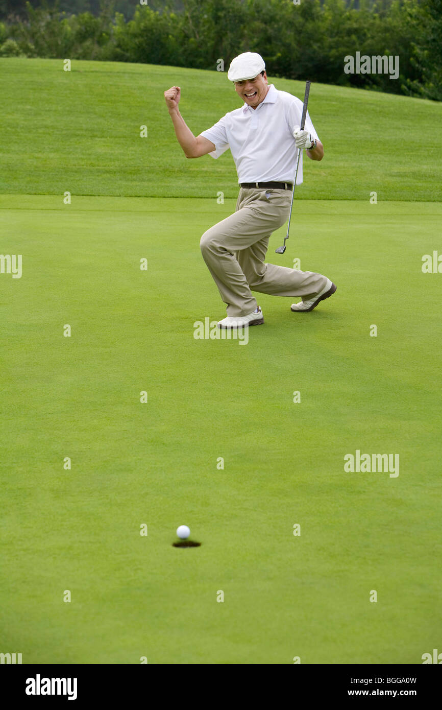 Golfer Celebrating a nice putt Stock Photo - Alamy