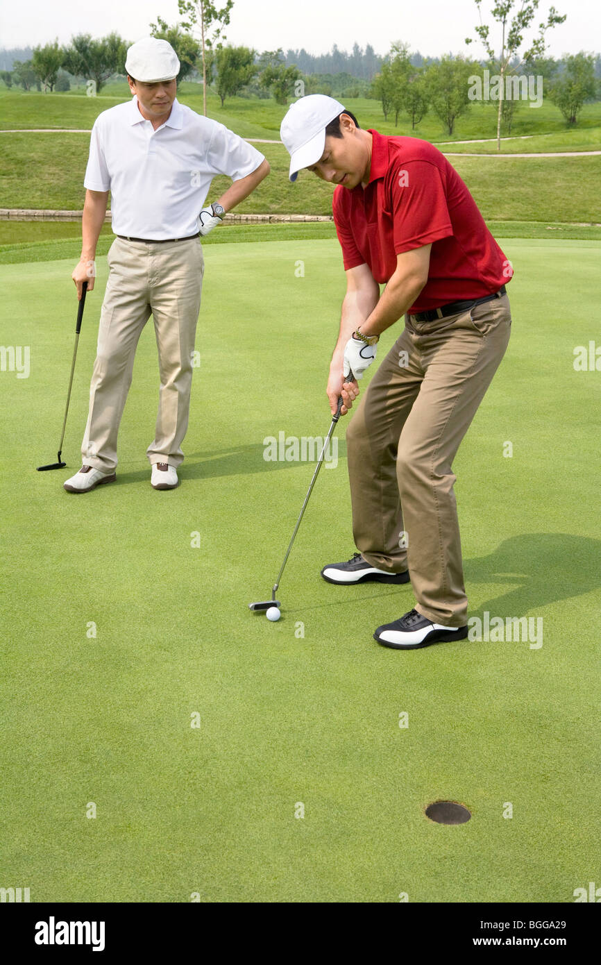 Two male Golfers on Green Stock Photo - Alamy