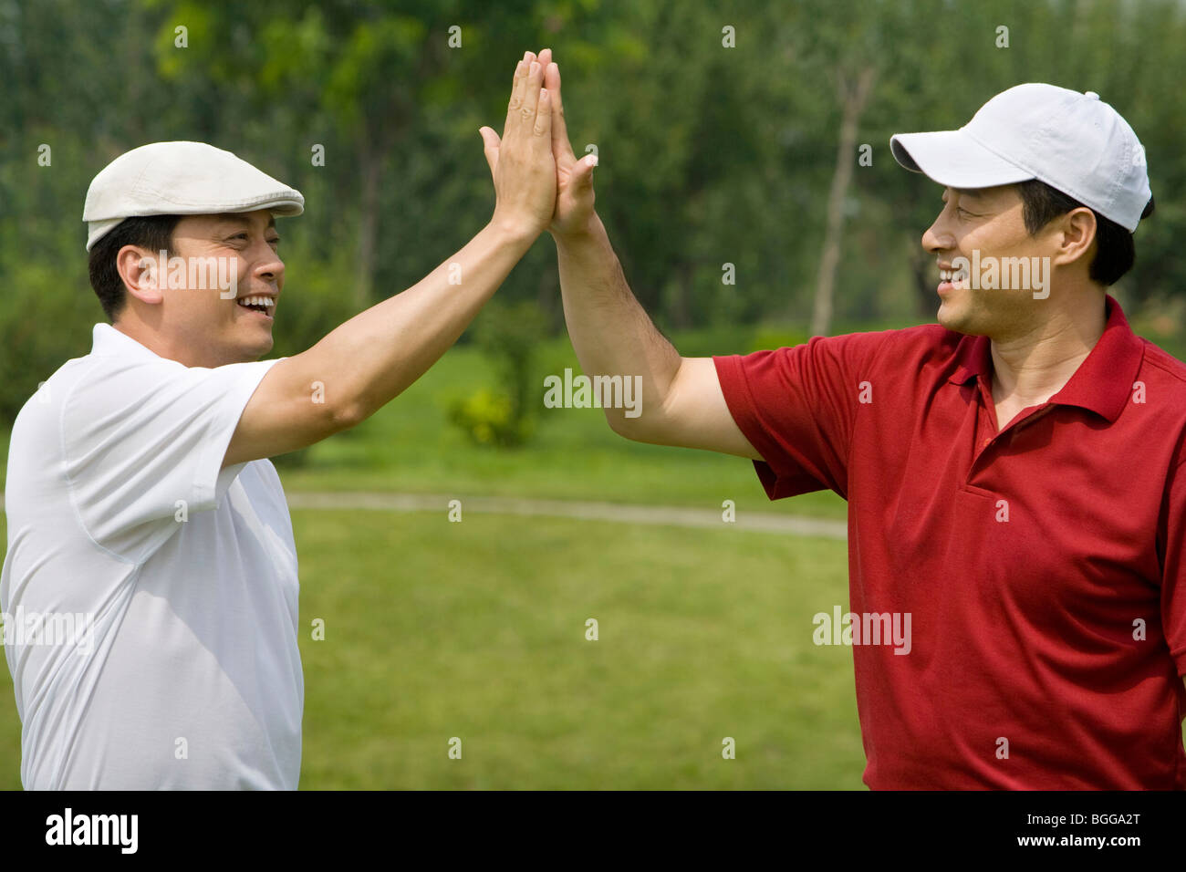 Two Golfers Celebrate a Great Shot Stock Photo - Alamy