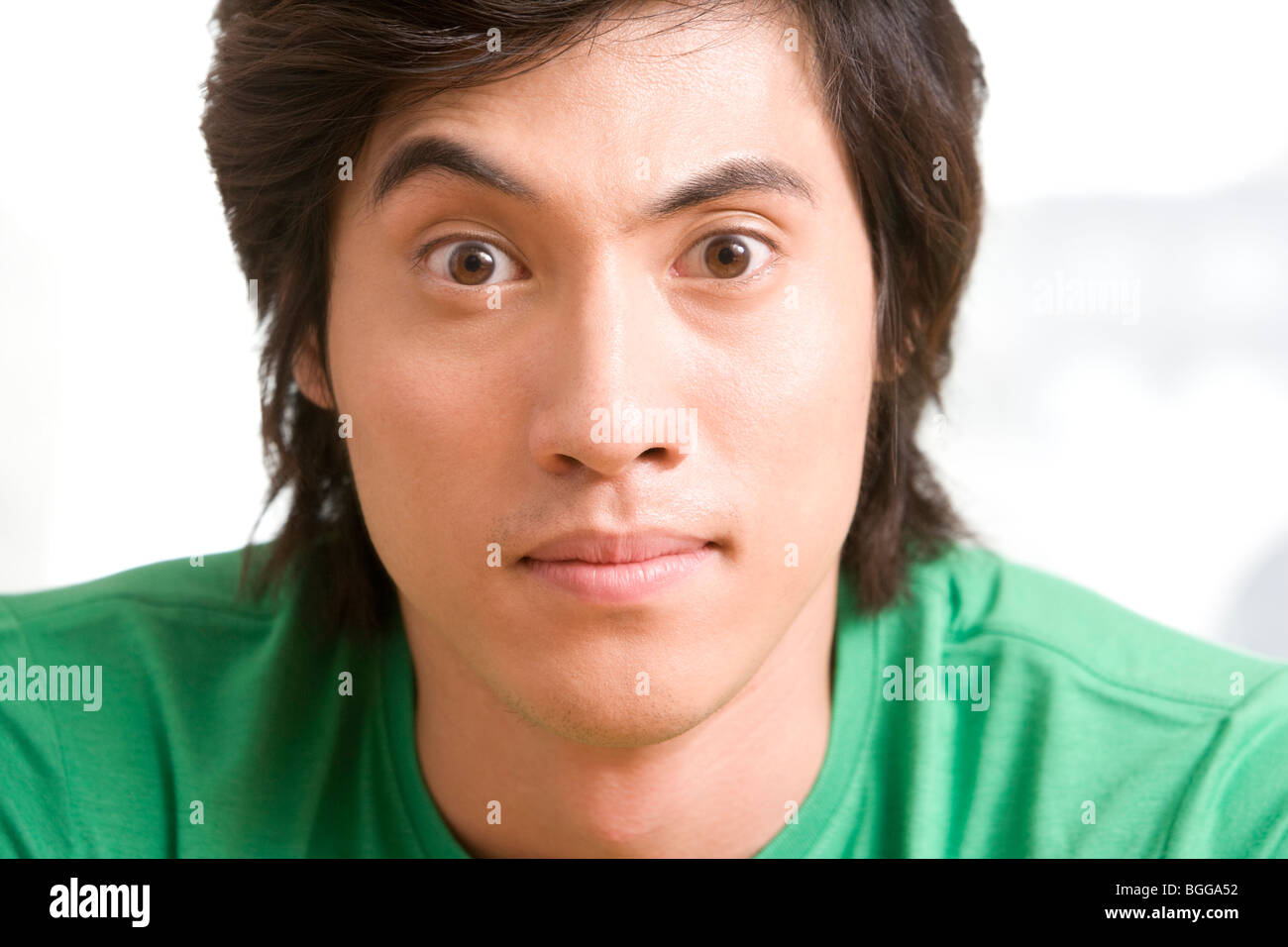 Asian man looking at the camera Stock Photo - Alamy
