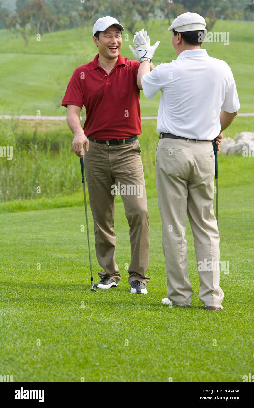Golfers high five hi-res stock photography and images - Alamy