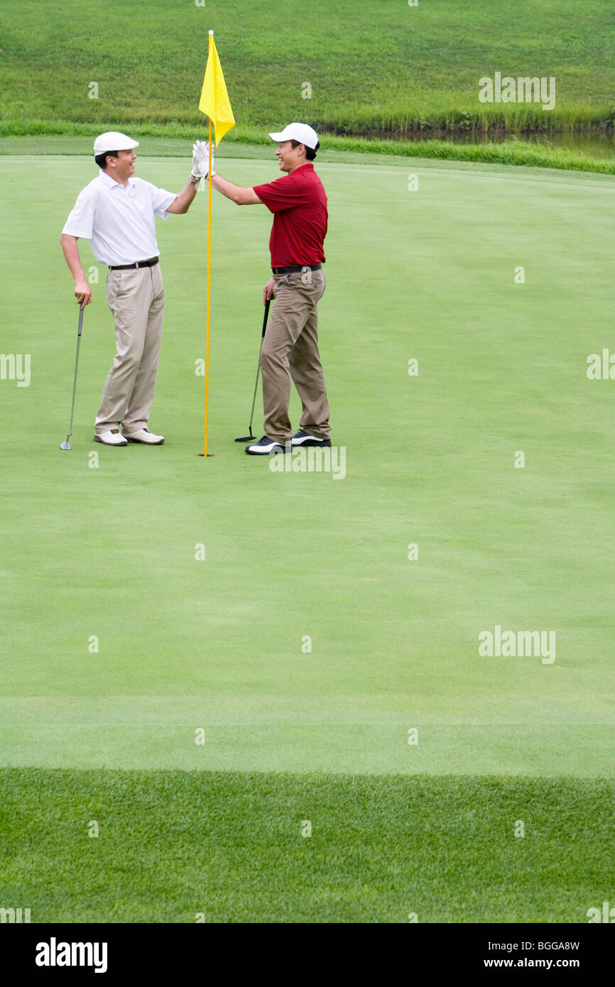 Golfers laughing hi-res stock photography and images - Alamy